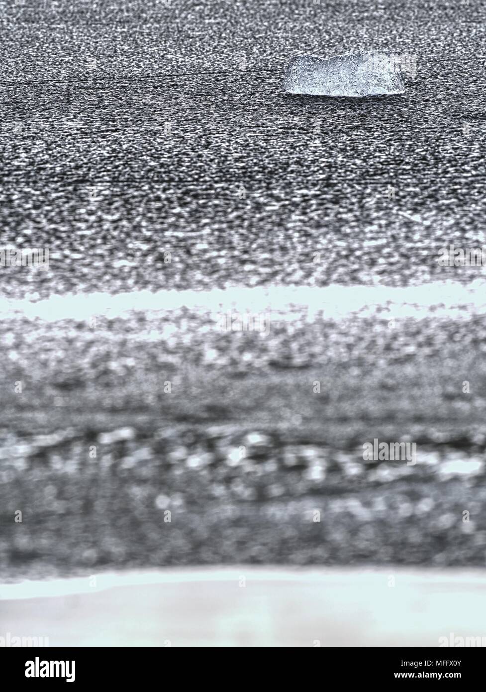 Winter coastal under icy cover. Icy andscape with broken pieces of blue ...