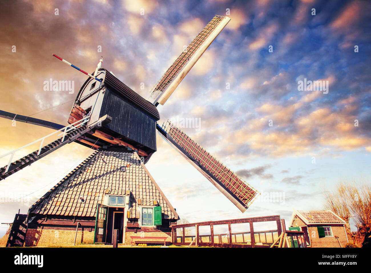 Colorful spring day with traditional Dutch windmills canal in Rotterdam ...
