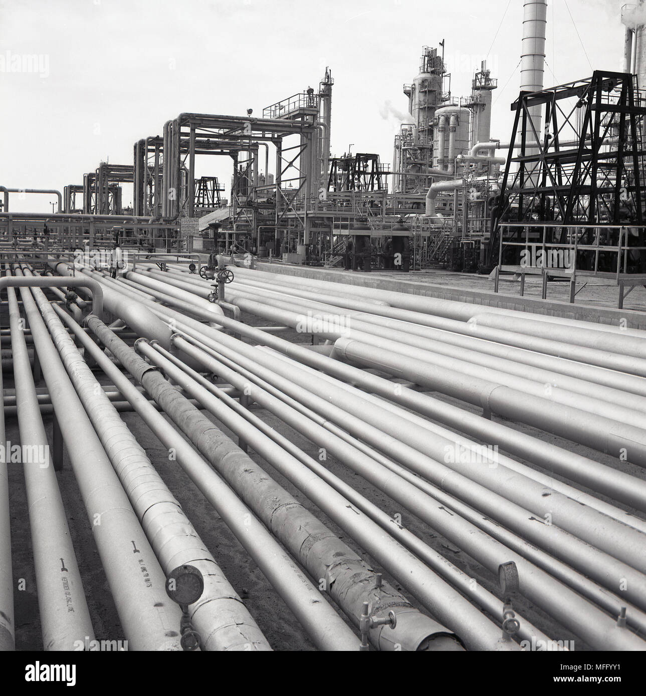 1960s, historical, Saudi Arabia, exterior view of an oil refinery and ...