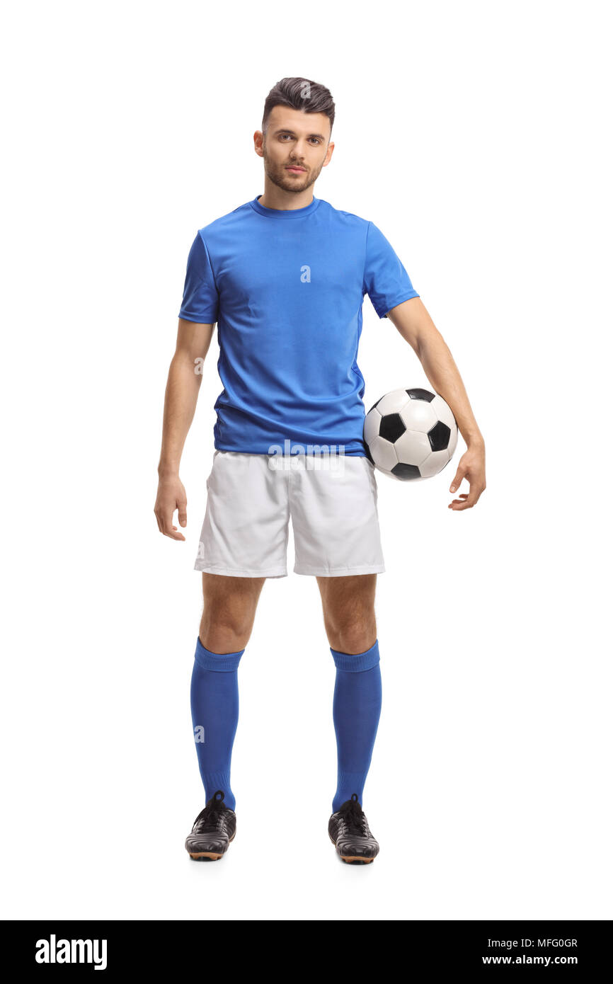 Full length portrait of a soccer player holding a football and looking ...