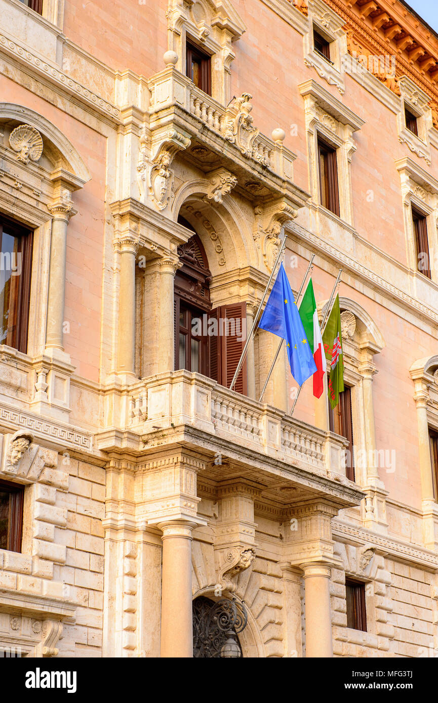 Italian and European Union flags on a balcony of the City Hall of ...