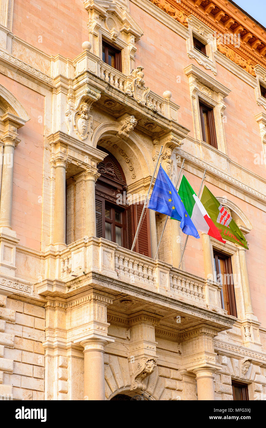 Italian and European Union flags on a balcony of the City Hall of ...