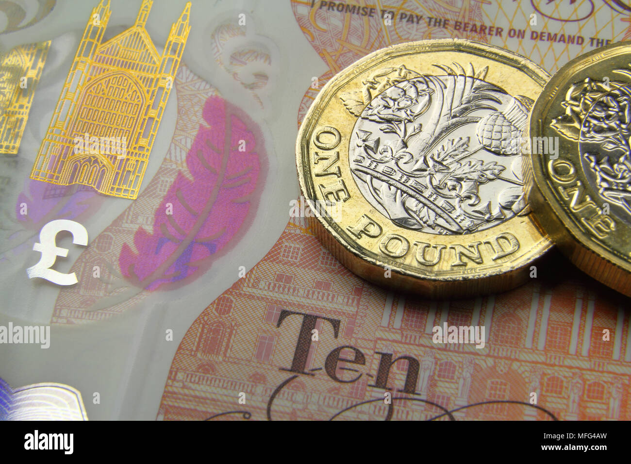 British ten Pound notes and one Pound coins close-up Stock Photo - Alamy