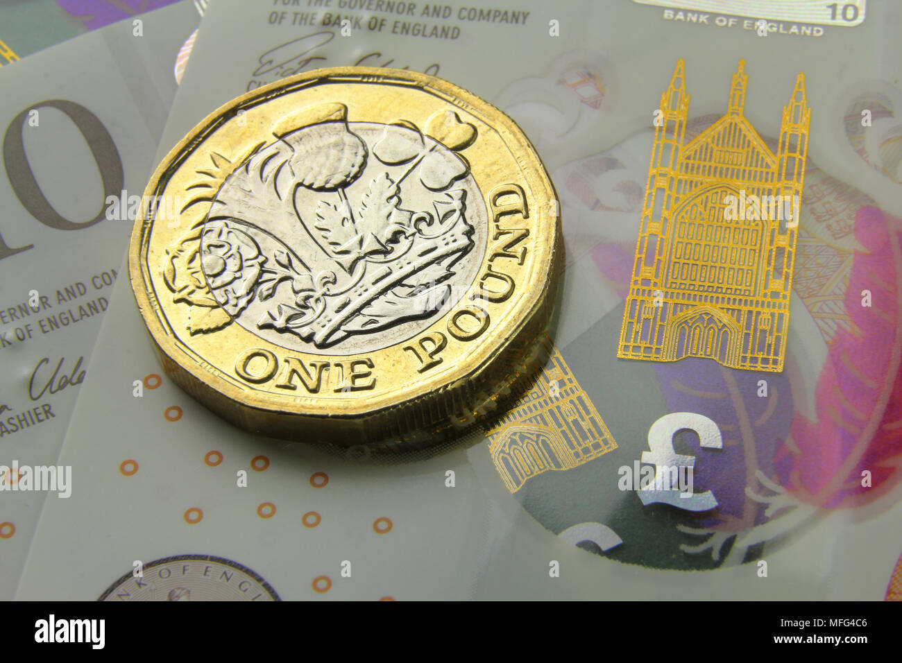 British ten Pound notes and one Pound coins close-up Stock Photo - Alamy