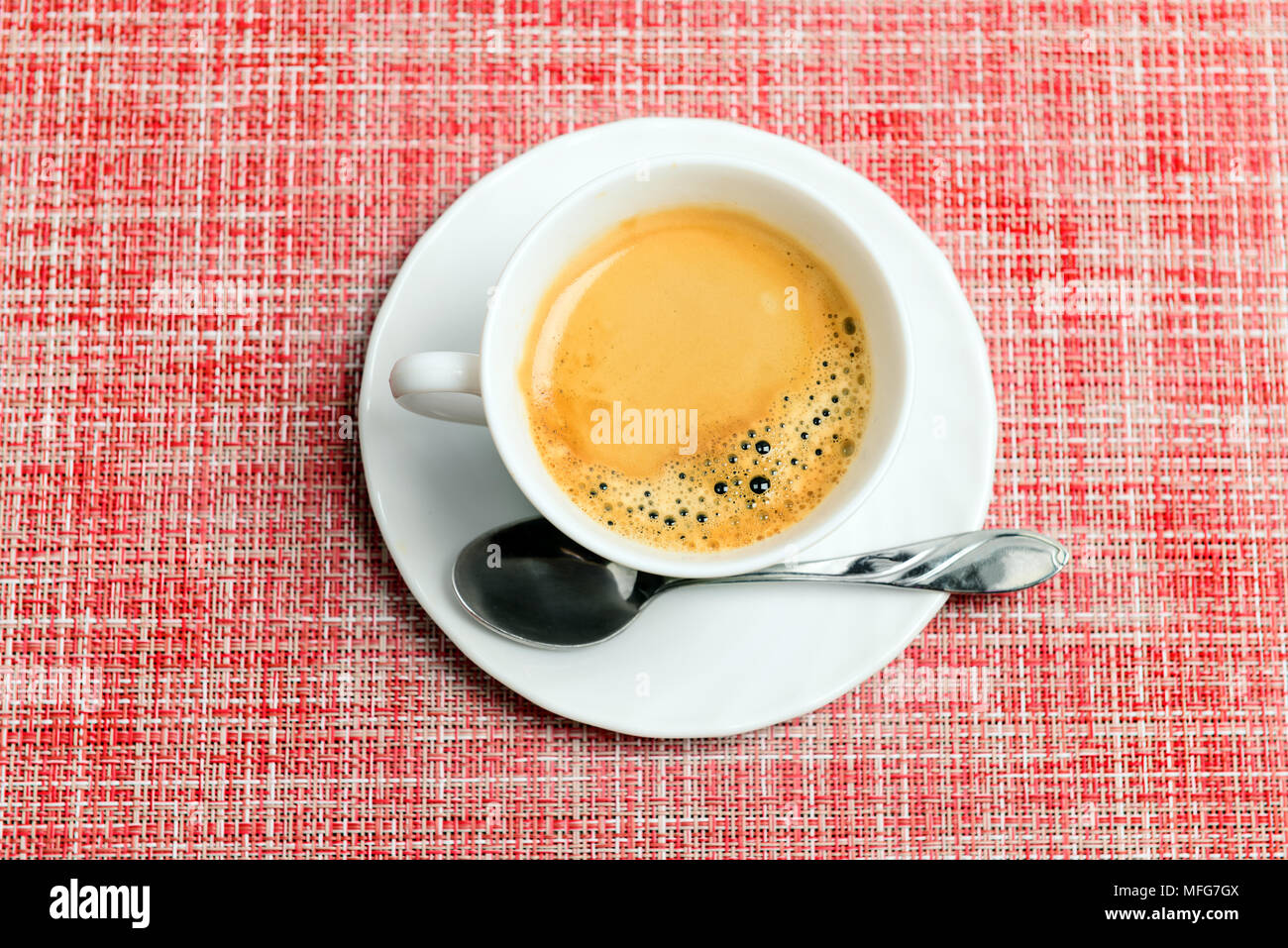 Cup of coffee on red textile, top view Stock Photo - Alamy