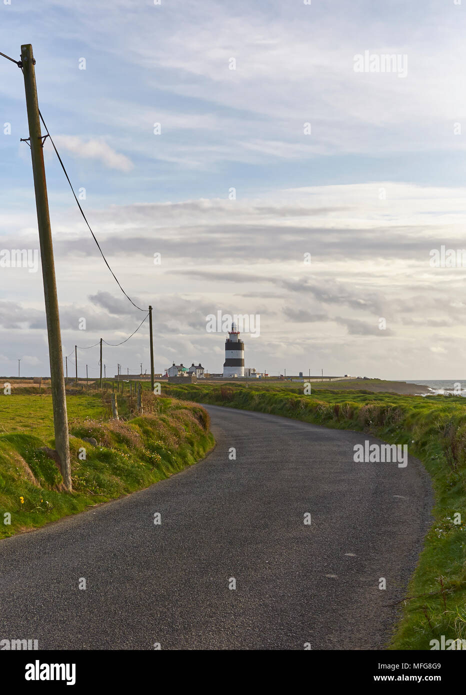 A curving Minor Irish Road leading to the Hook Lighthouse at Hook Point ...