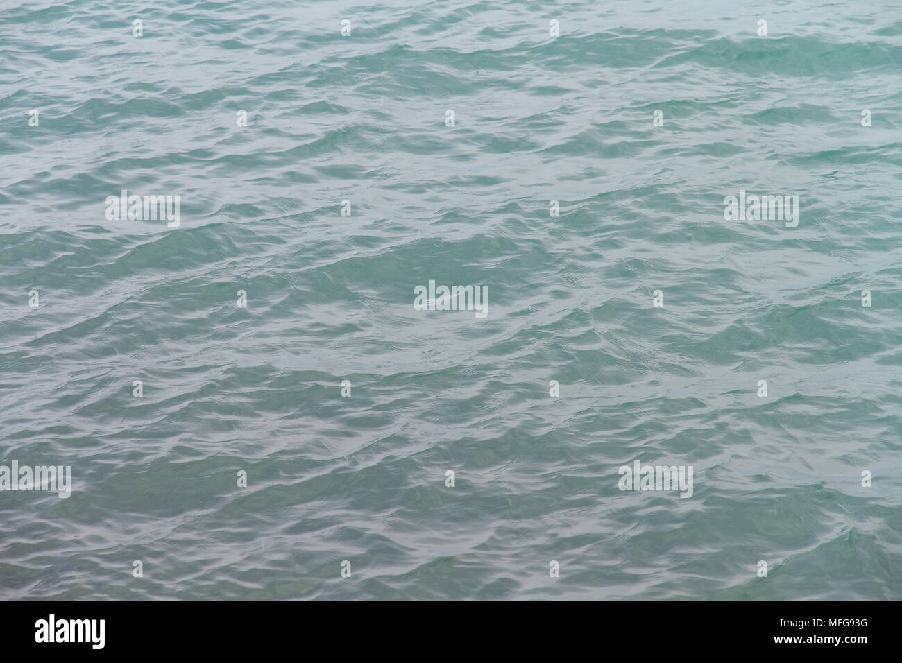 A water surface with small ripples background image Stock Photo - Alamy