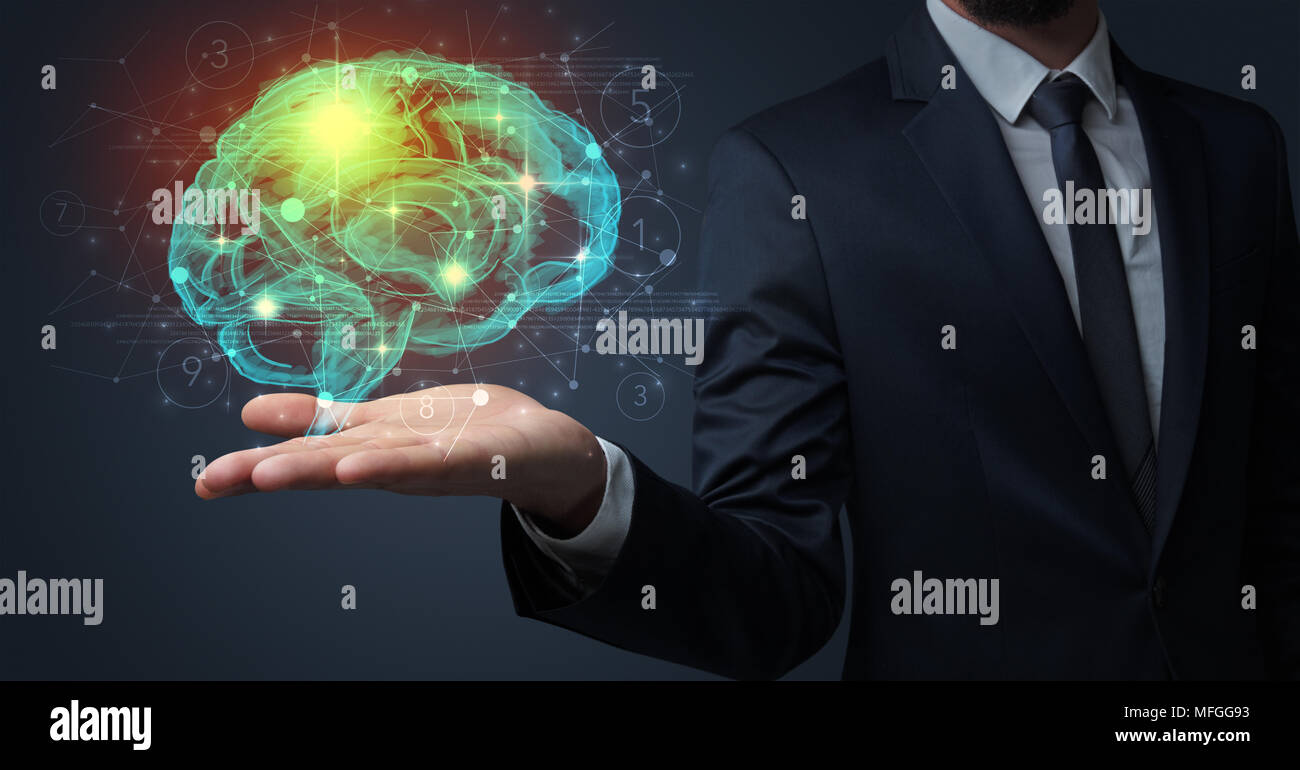 Businessman holding human brain on his hand with logistics symbols ...