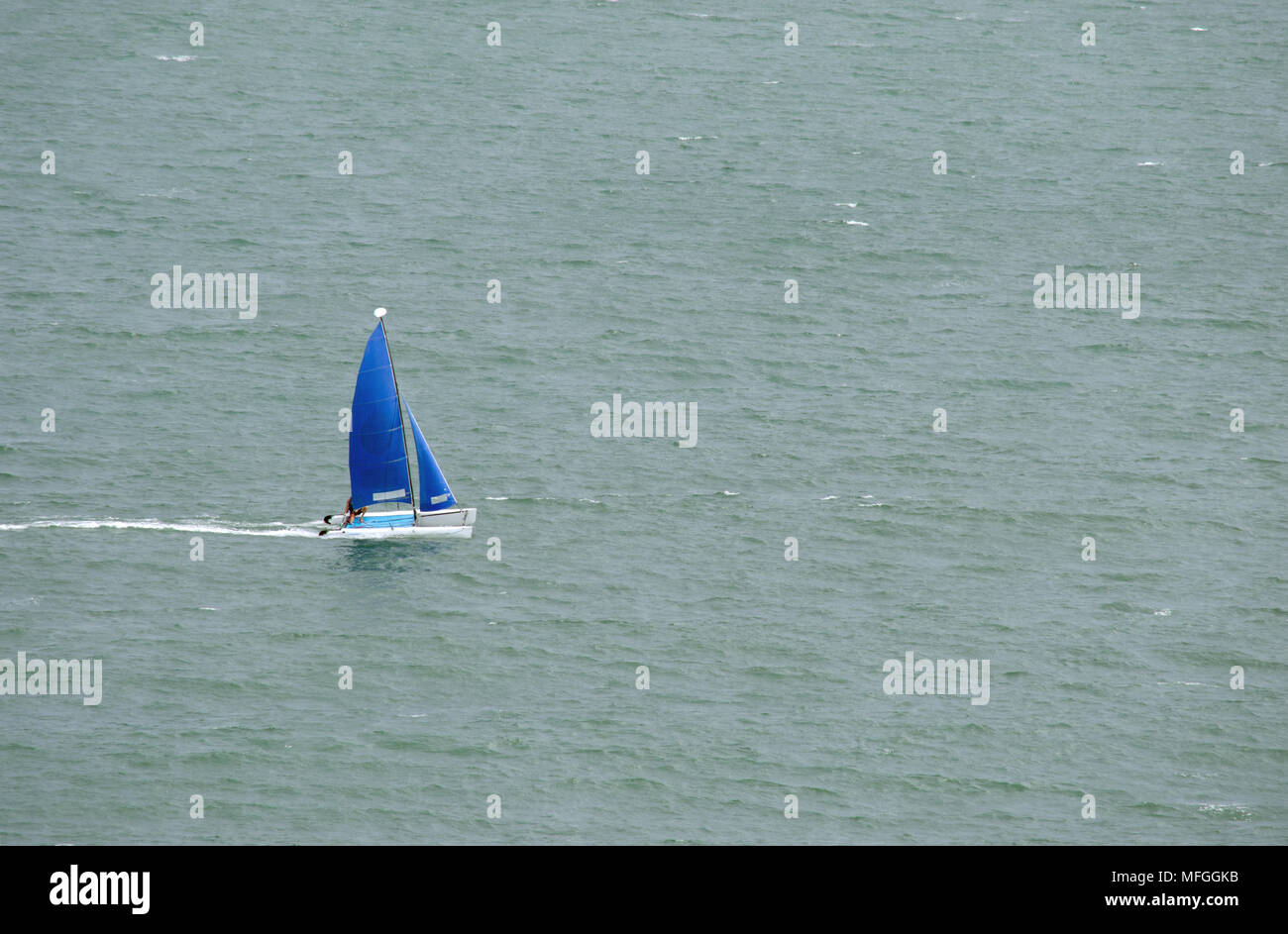 small blue sail boat Stock Photo - Alamy