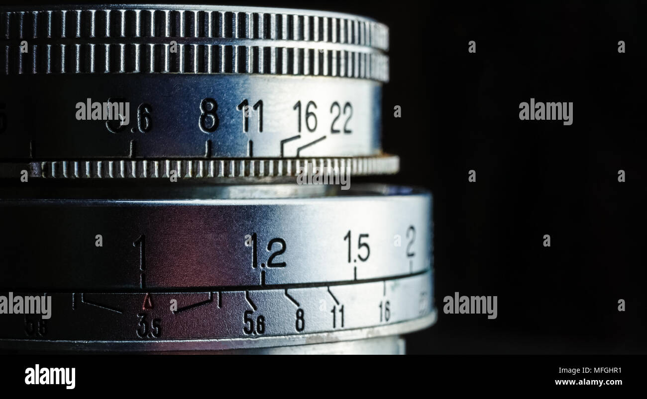Beautiful closeup of an old vintage camera lens with aperture values ...