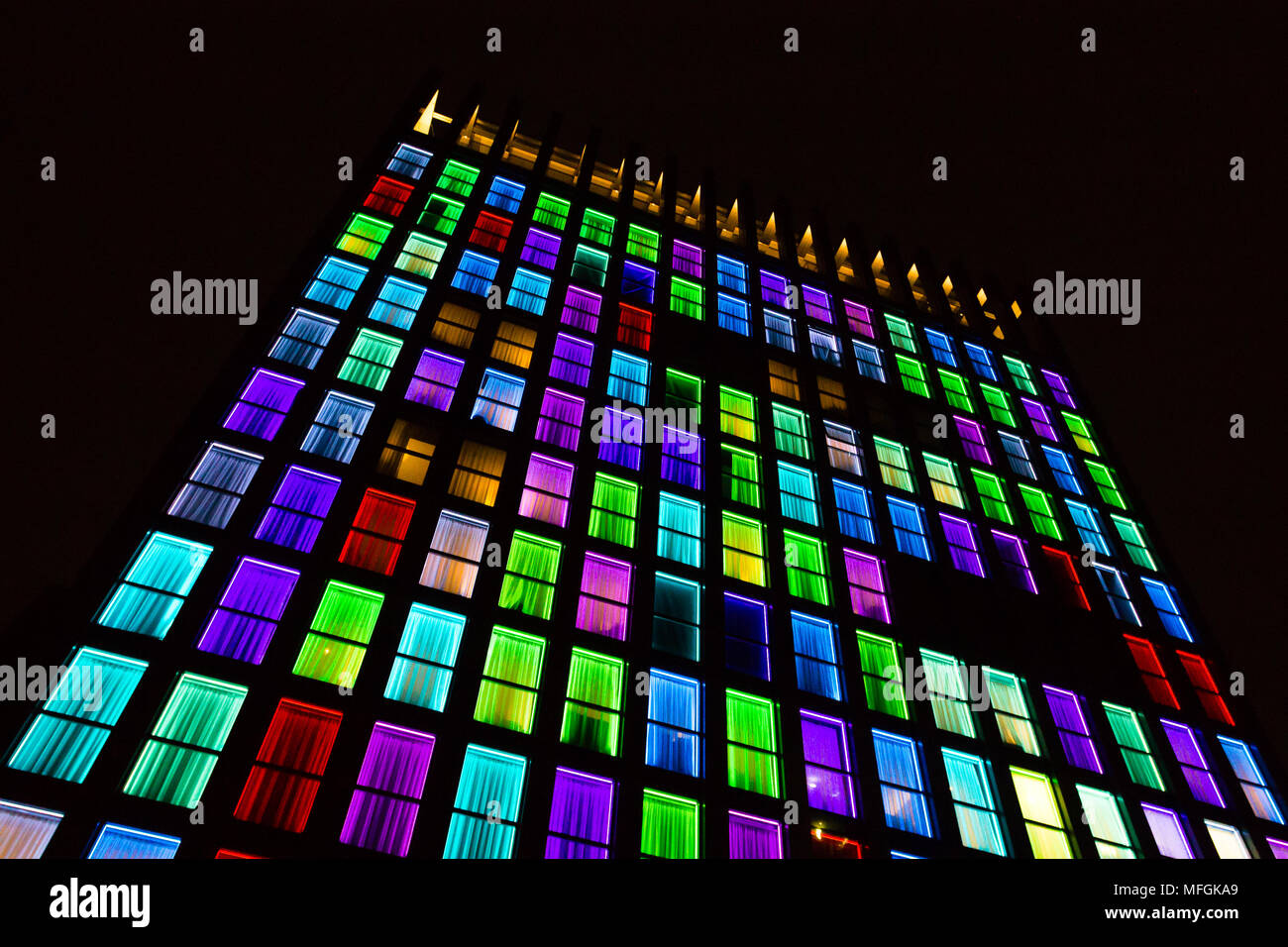 Colored windows texture. Windows illuminated by neon lights background ...