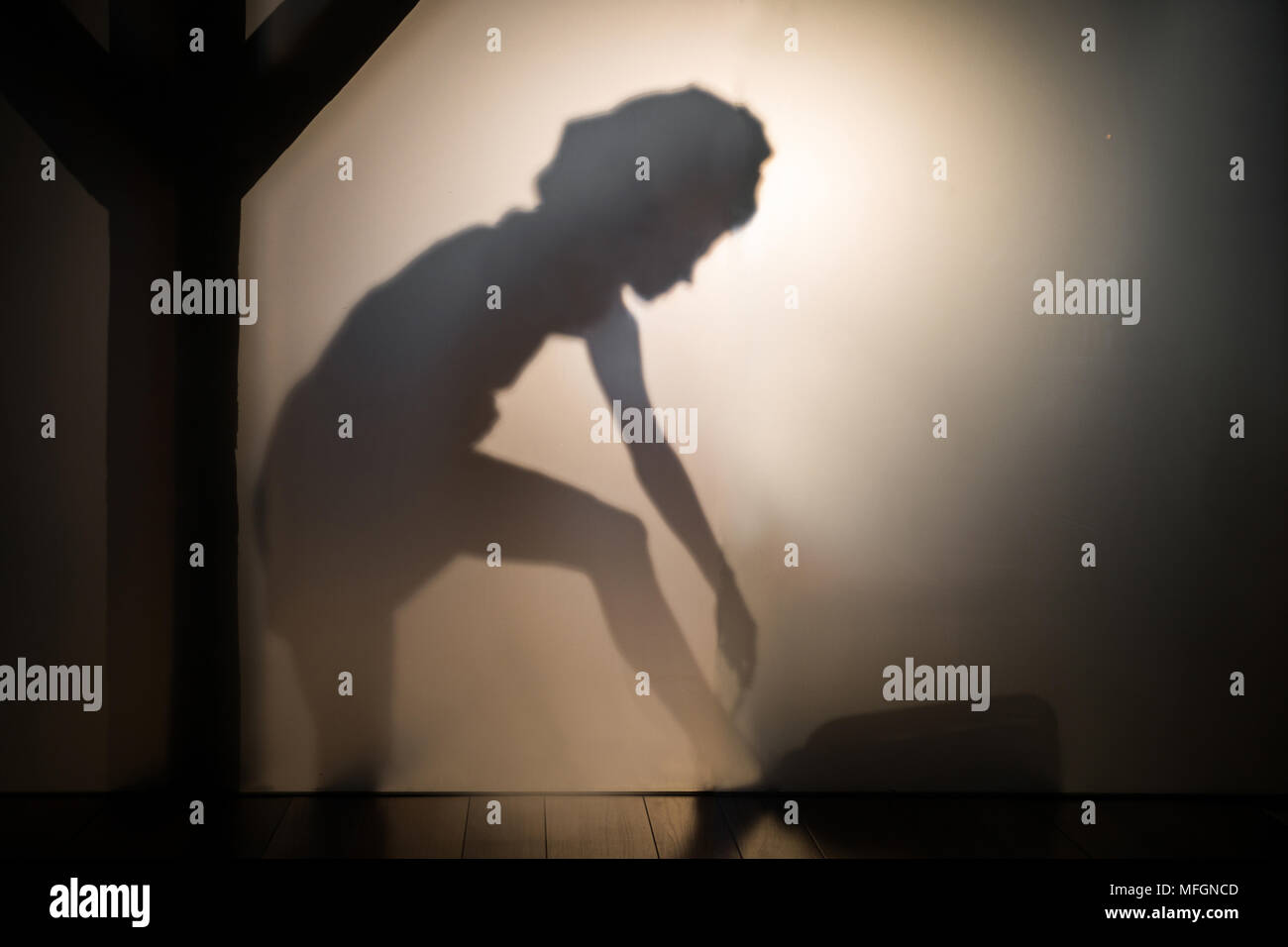 Portrait of woman shadow shaving her legs Stock Photo - Alamy