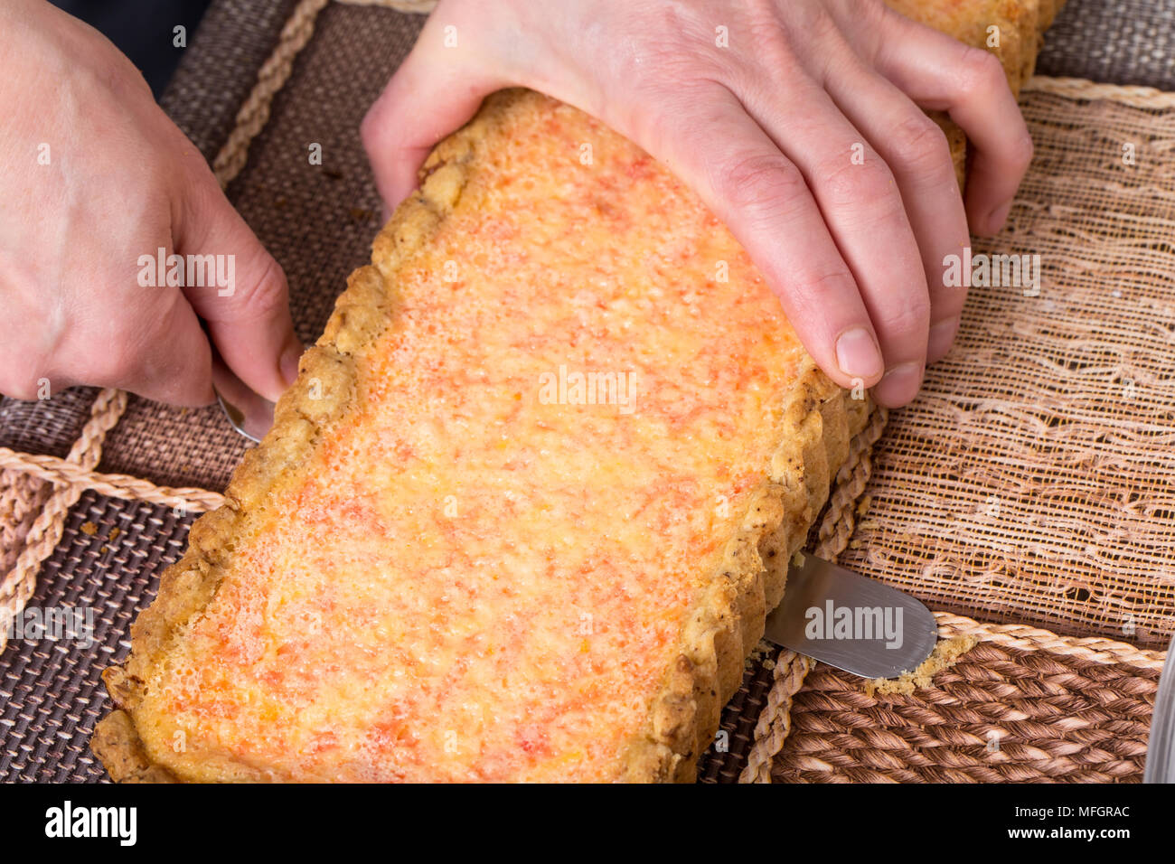 Taking off tart from baking pan. Photo can be used as a whole ...