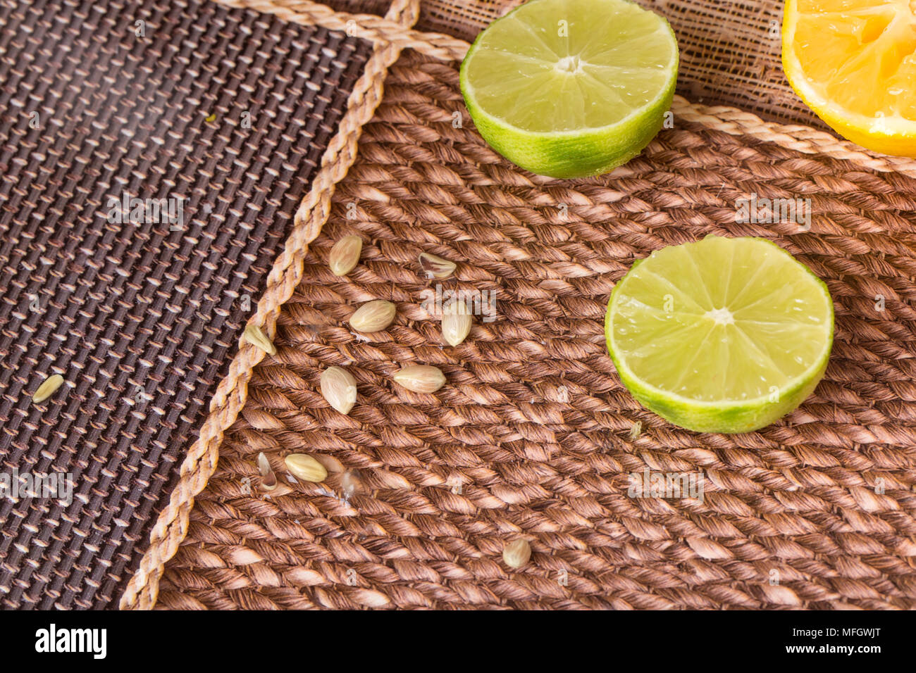 Sliced limes and seeds closeup on a table as a background Stock Photo ...