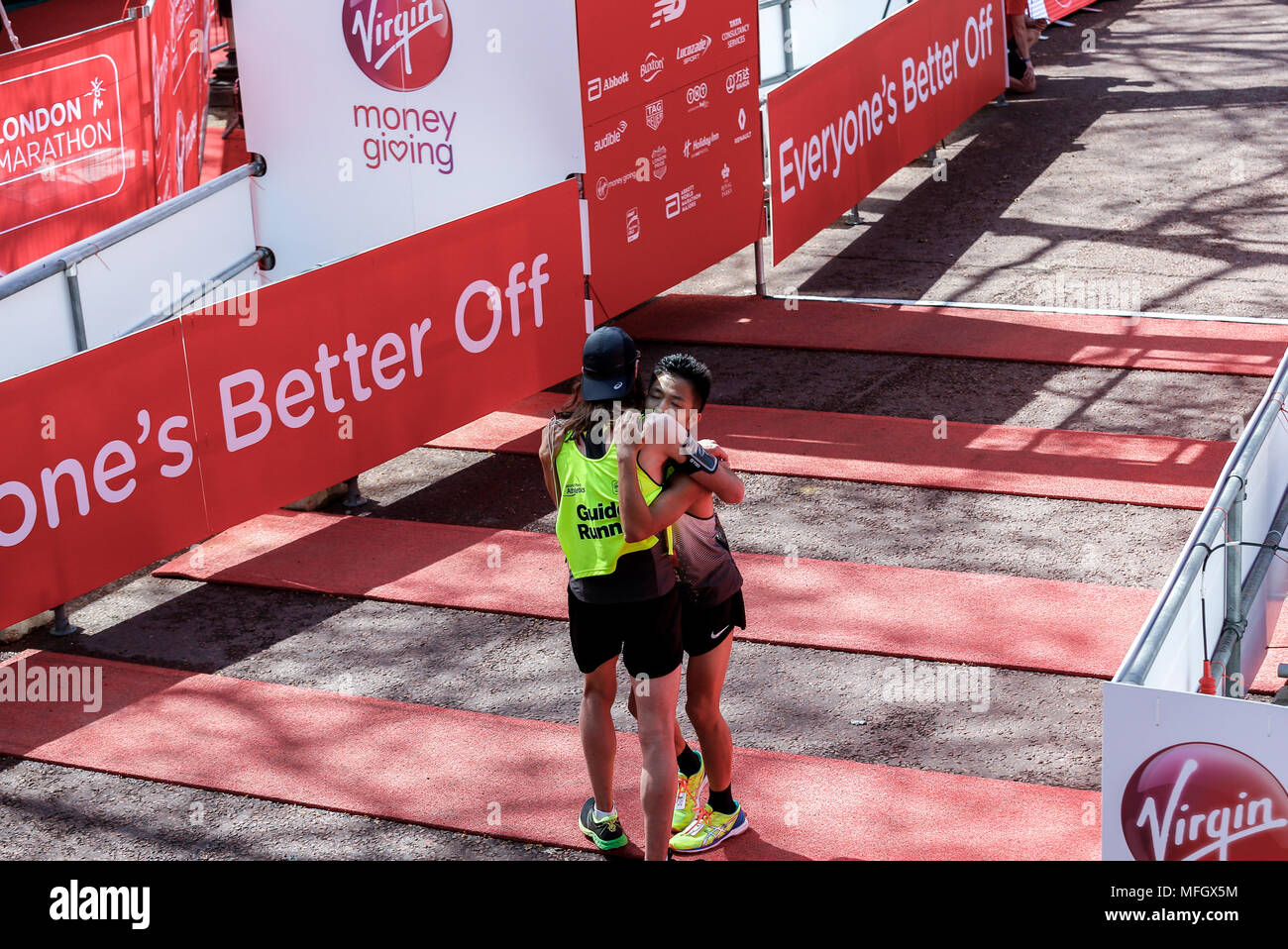 Yap TIEN-FUNG tired and emotional after crossing the finish line in ...