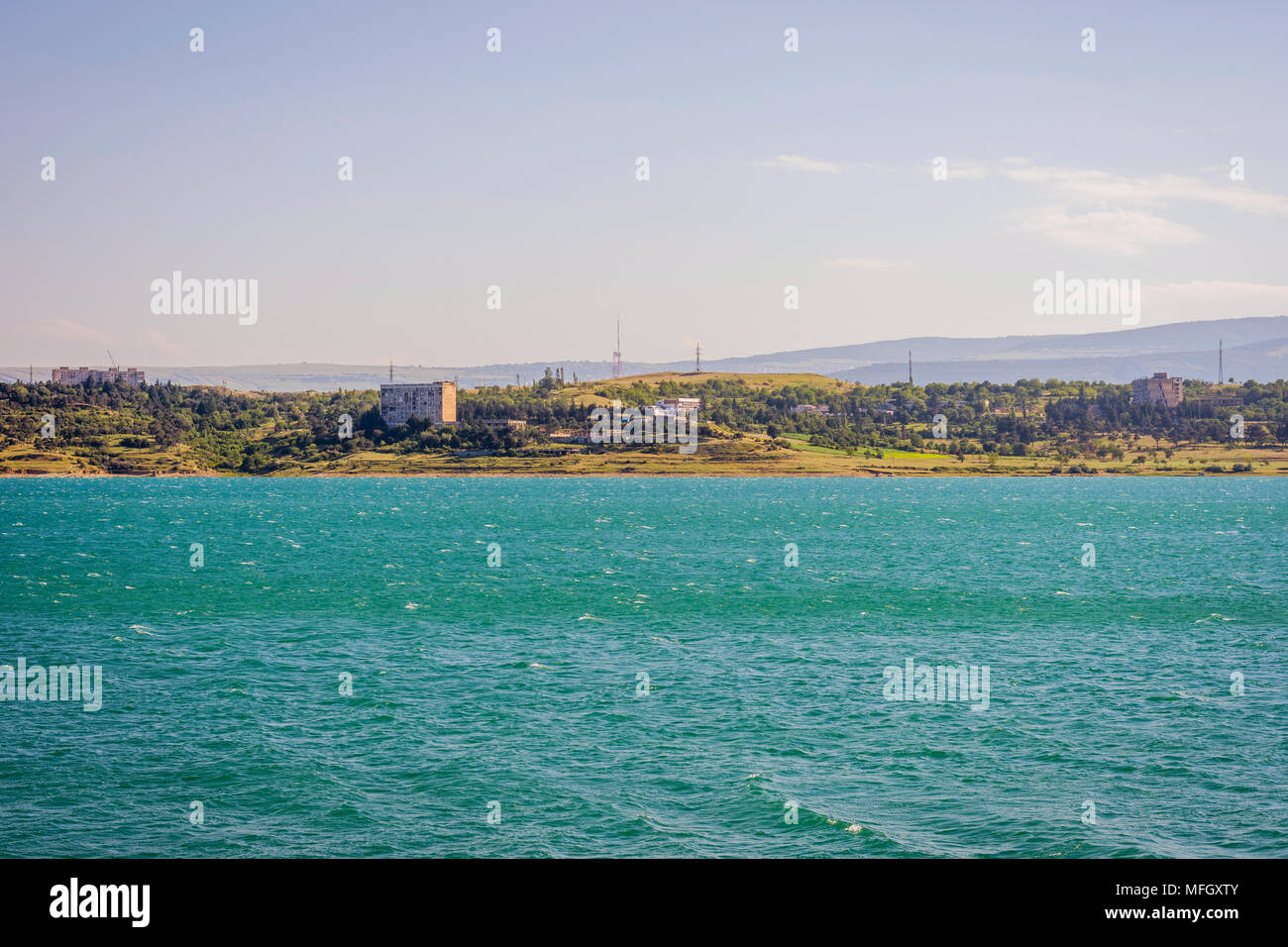 Colorful water of Tbilisi sea lake, next to the town, Georgia Stock ...