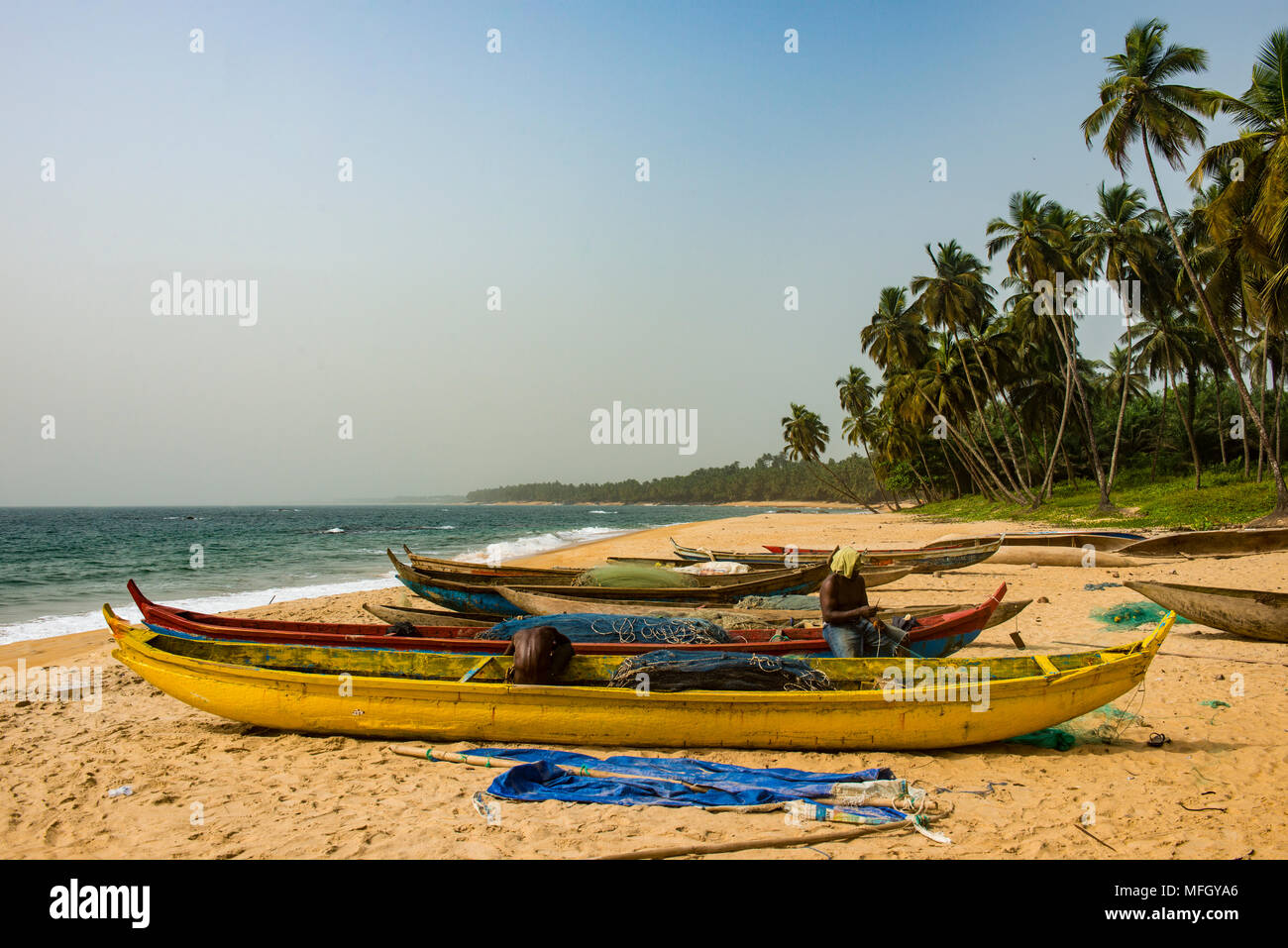 Fishing boats on a beautiful beach, Neekreen near Buchanan, Liberia ...