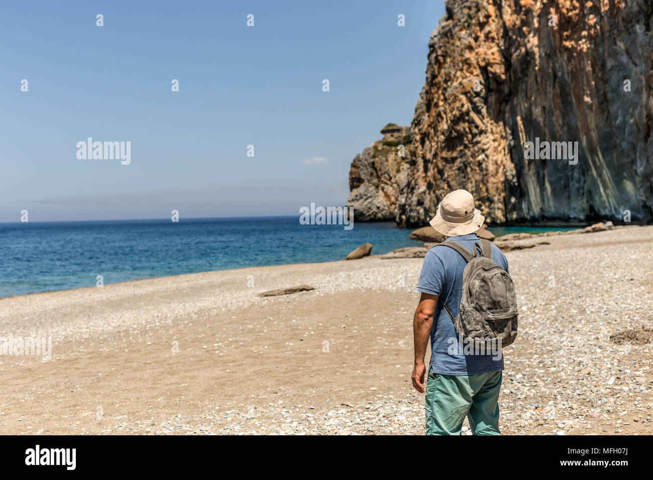 Back view portrait of a traveller man in summer outfit with gray ...