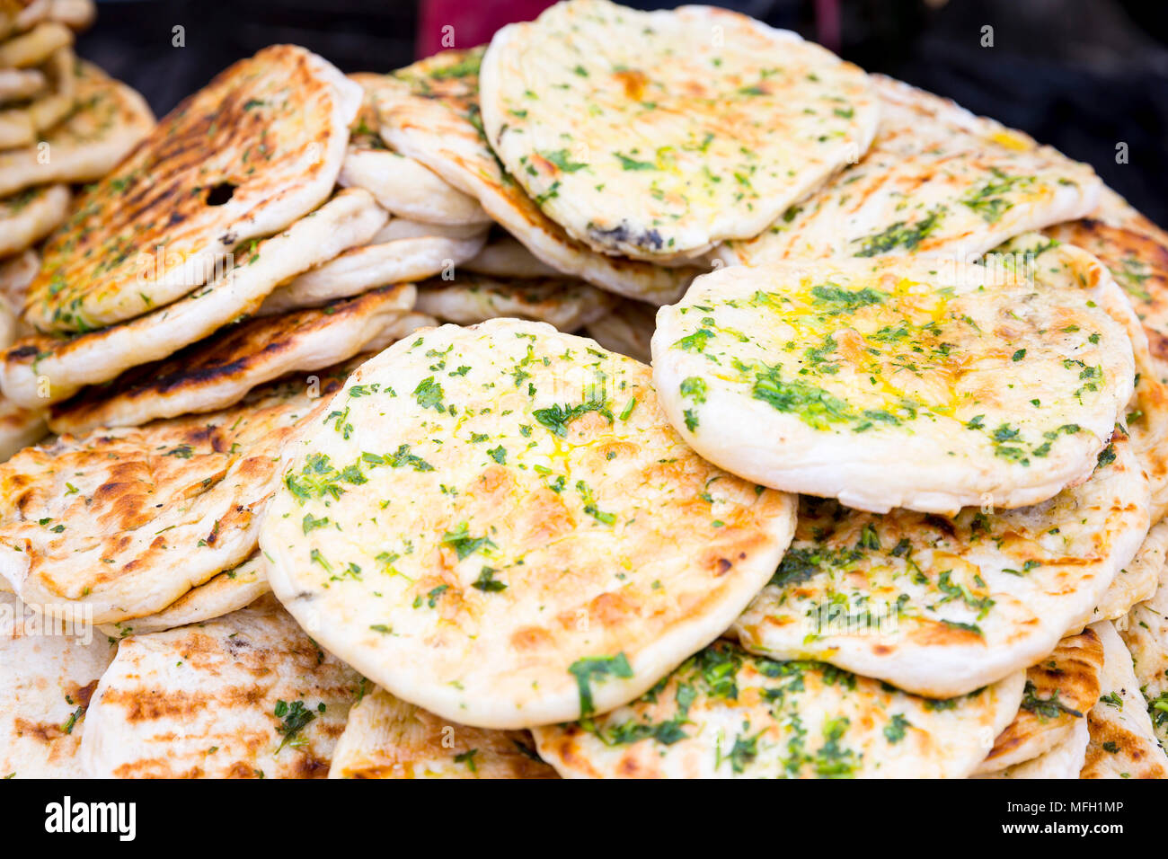 Doner kebab bread slices with garlic, oil and parsley Stock Photo - Alamy