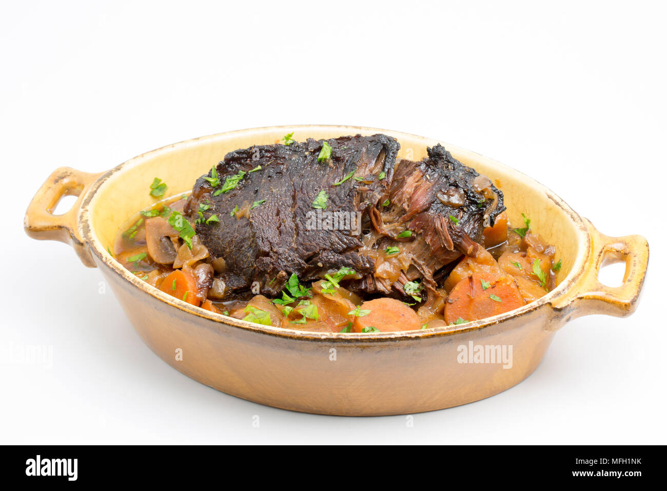 An Ox cheek that has been browned in a copper frying pan and then slow ...