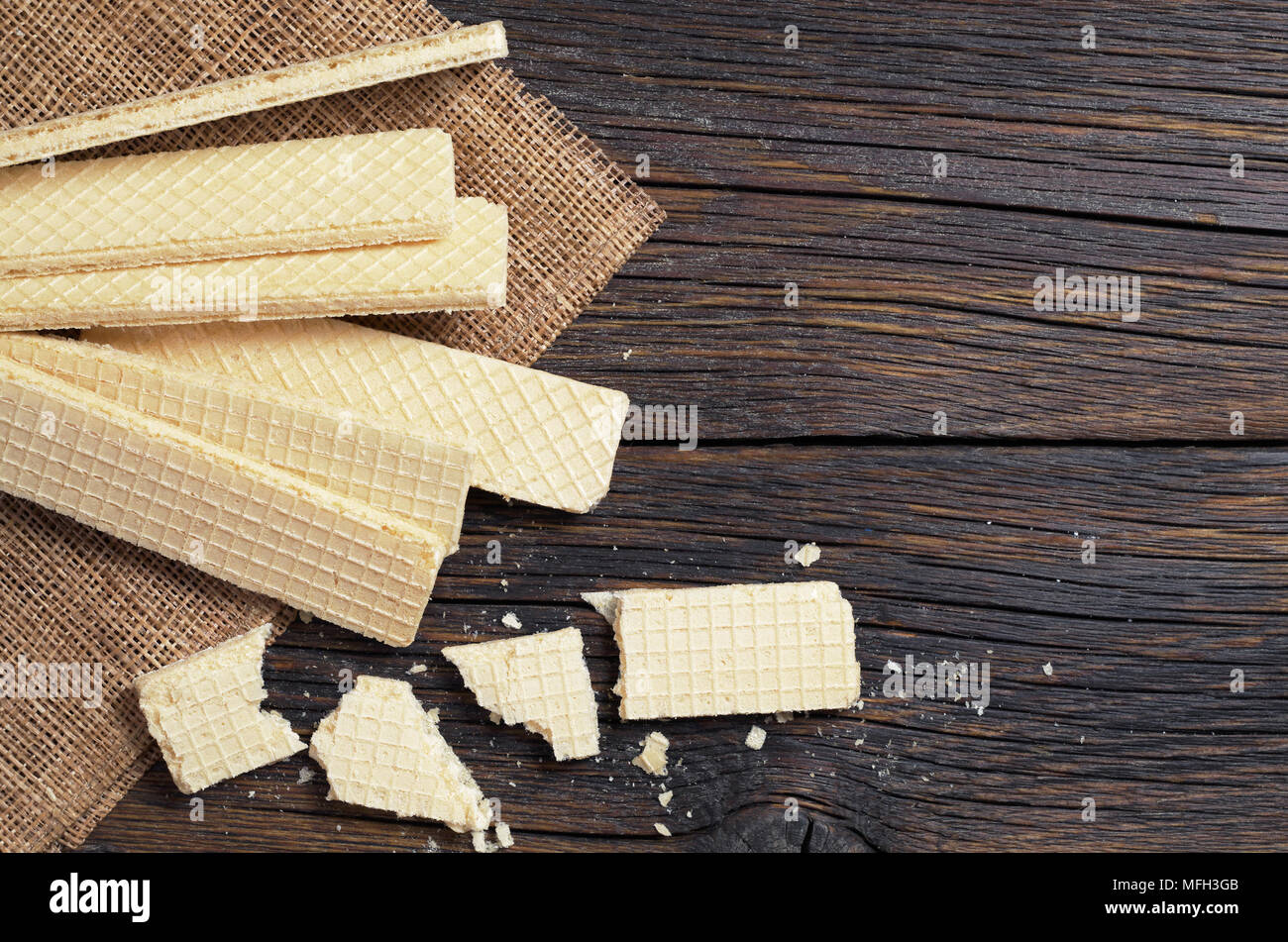 Heap of wafers on rustic wooden table, top view Stock Photo - Alamy