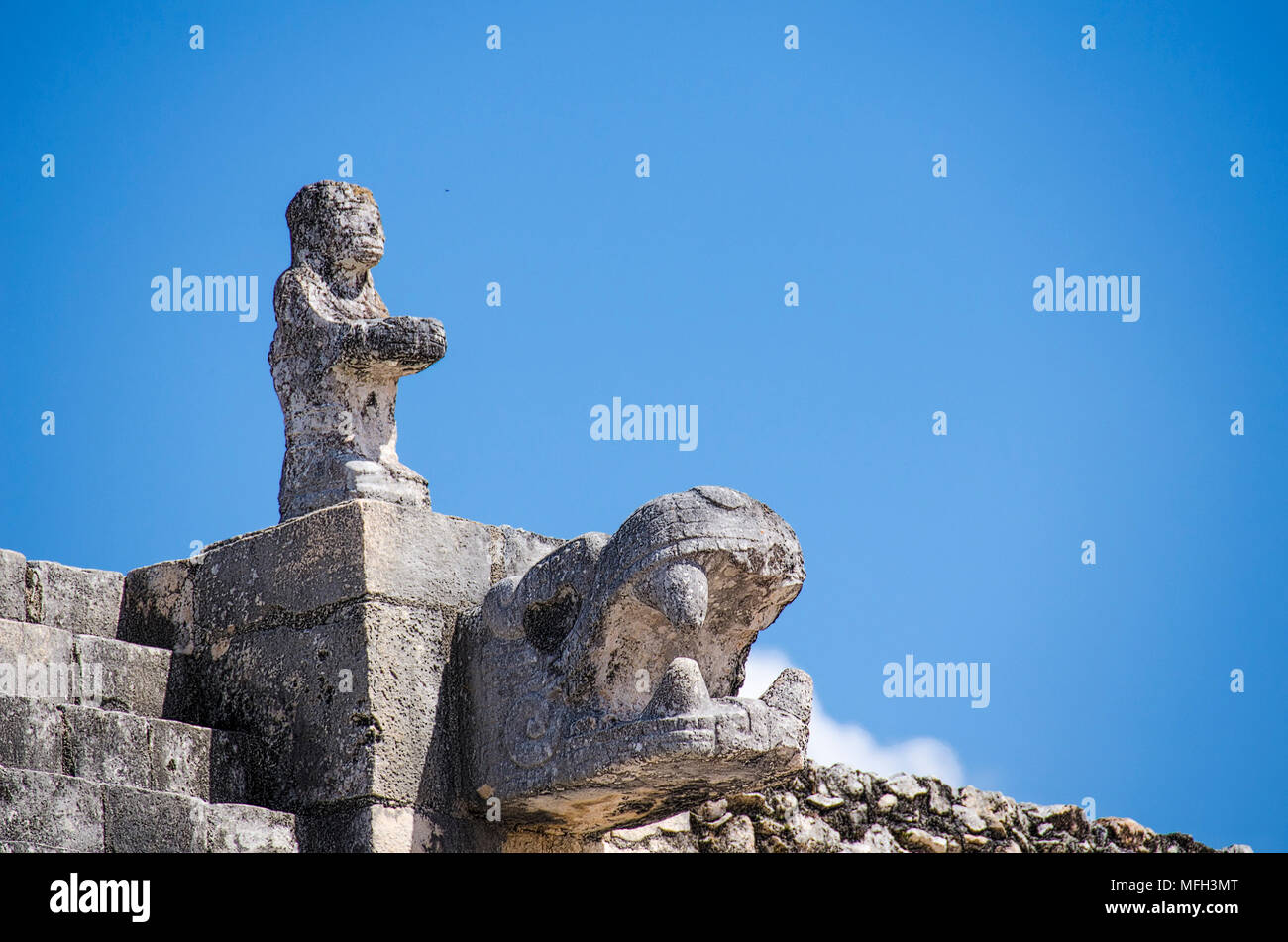 Detail of human statue and snake head at the Warriors Temple Stock ...