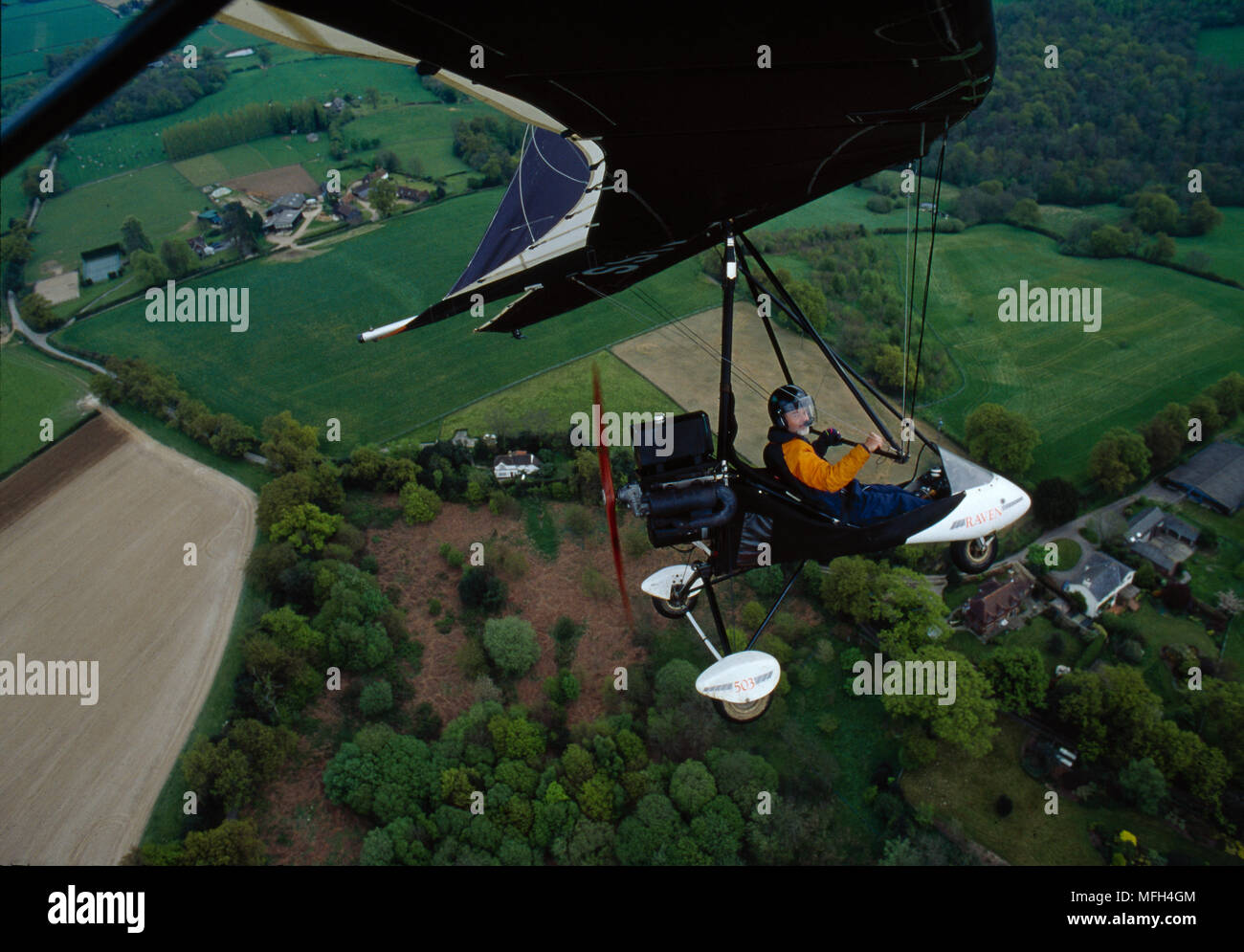 FLEXWING MICROLIGHT AIRCRAFT in flight over Weald of Sussex, southern ...