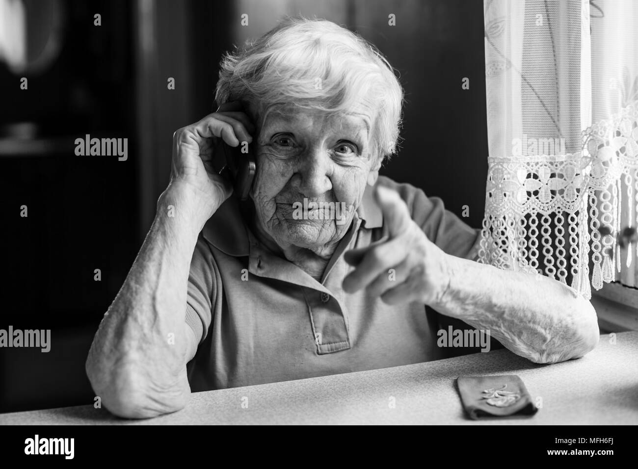 Elderly telephone Black and White Stock Photos & Images - Alamy