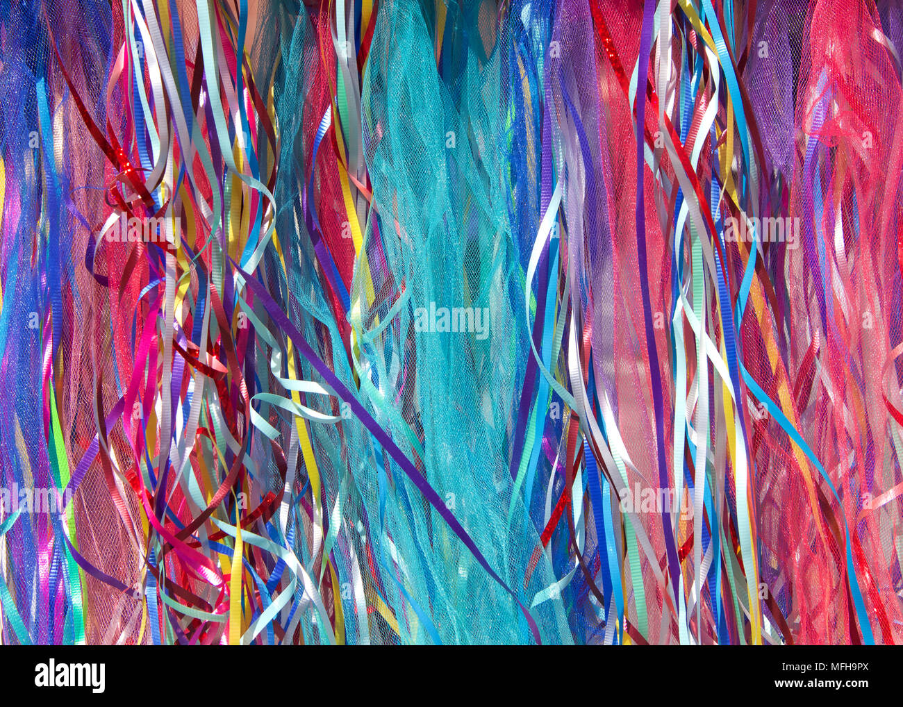 background of thin ribbons and tulle hanging down through the frame ...