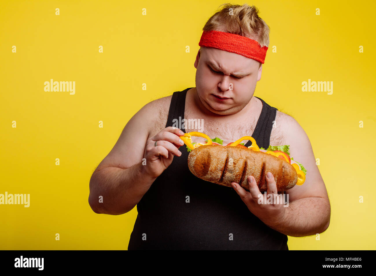 Diet failure of fat man eating fastfood . Happy smile overweight male ...