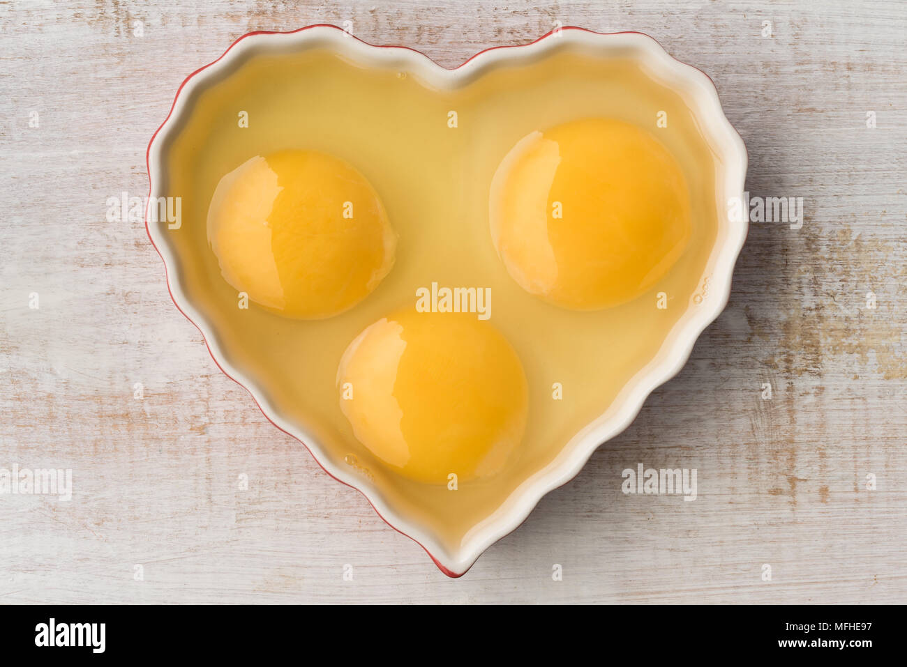 Raw Eggs in a Heart Shape Stock Photo - Alamy
