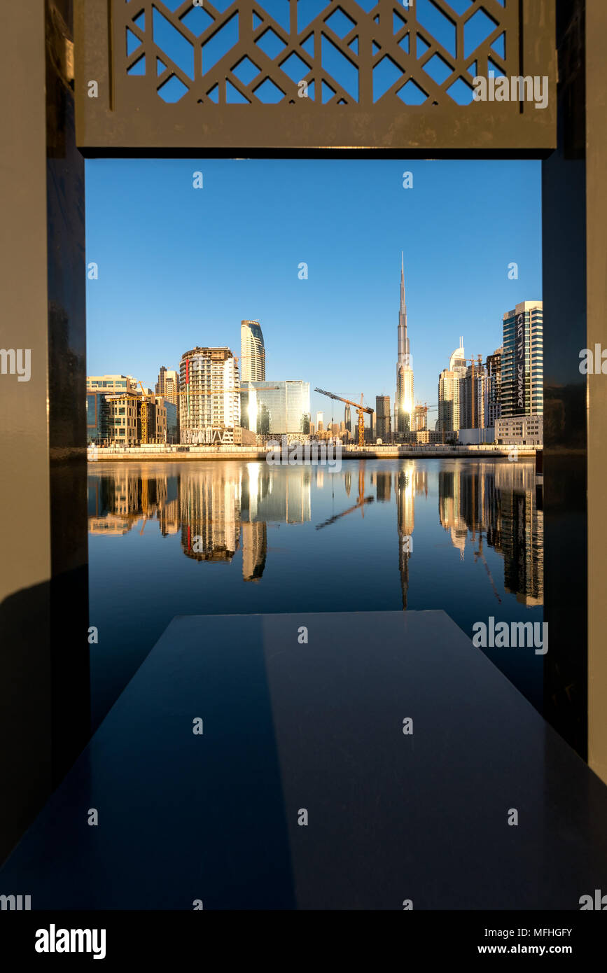 Scenic view of Dubai skyscrapers reflection in one frame Stock Photo ...