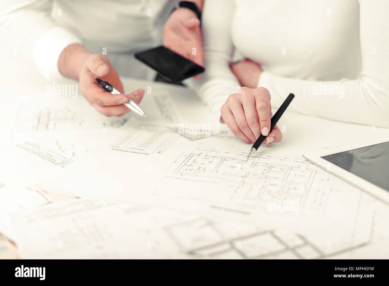 Engineer team meeting blueprints hi-res stock photography and images ...