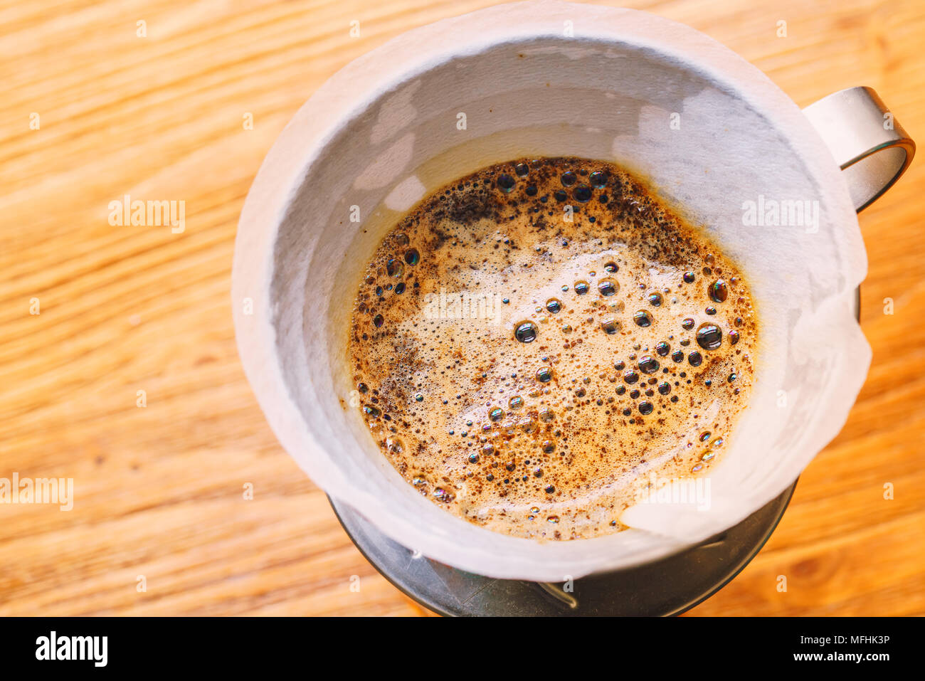 Drip brewing filtered coffee Stock Photo - Alamy
