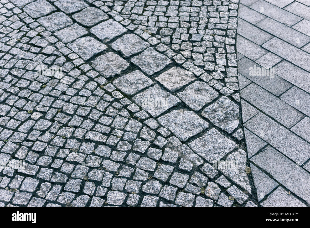 Walkway with pattern of different cobblestone sizes and orientations ...