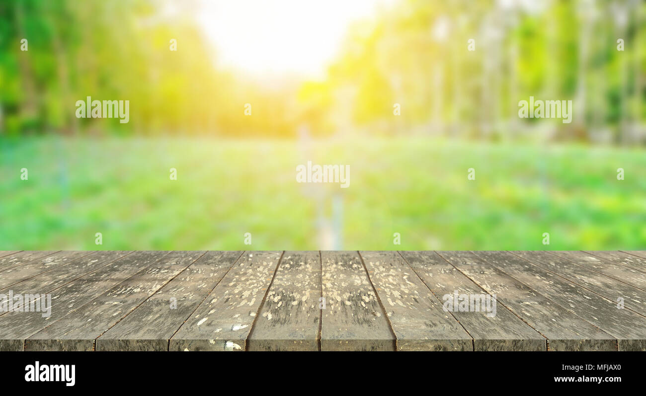 Wooden table top with blurred nature background in the morning and ...