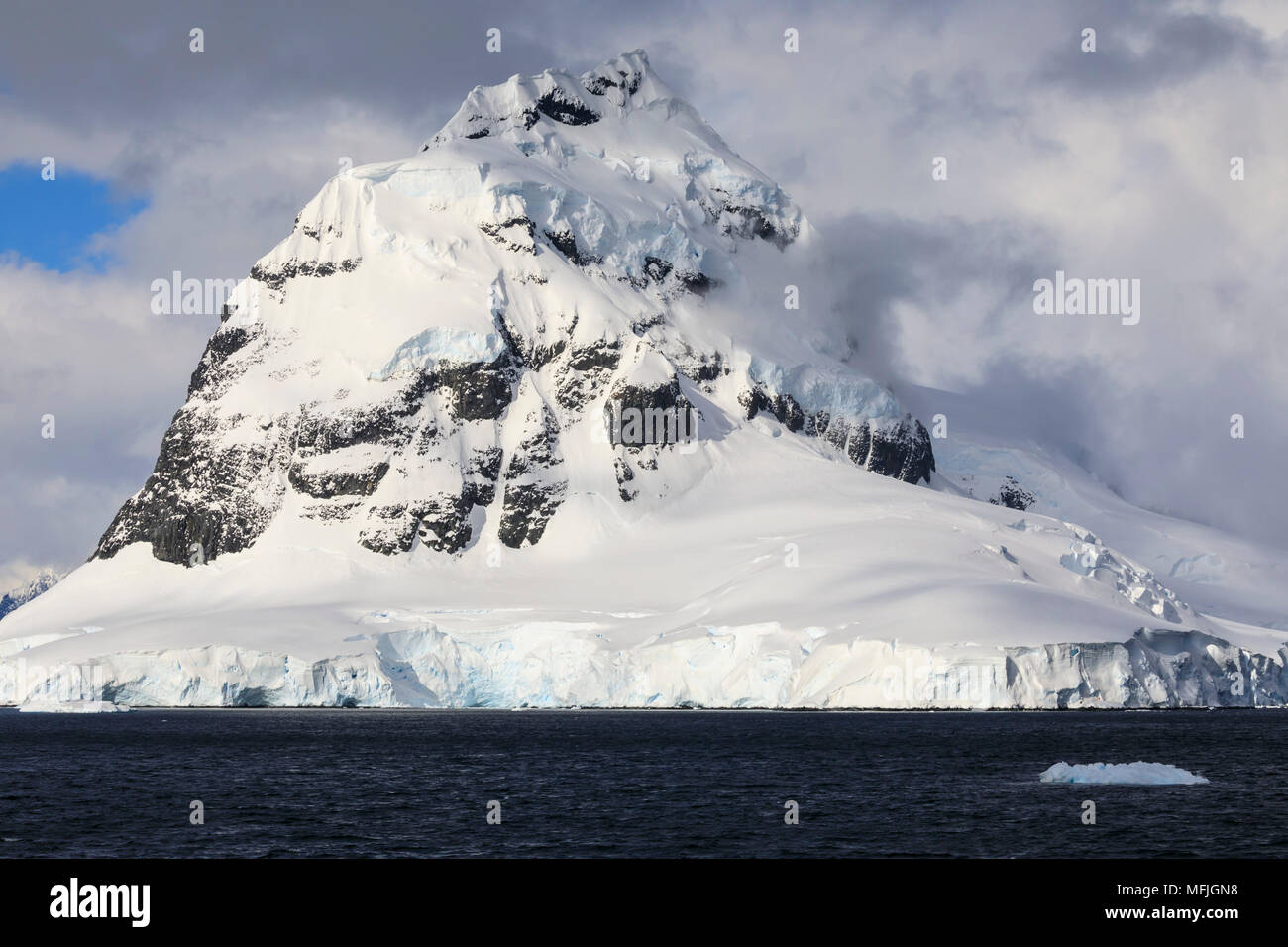 Glaciers, pyramidal mountain peak and dramatic clouds and sky, Cape ...