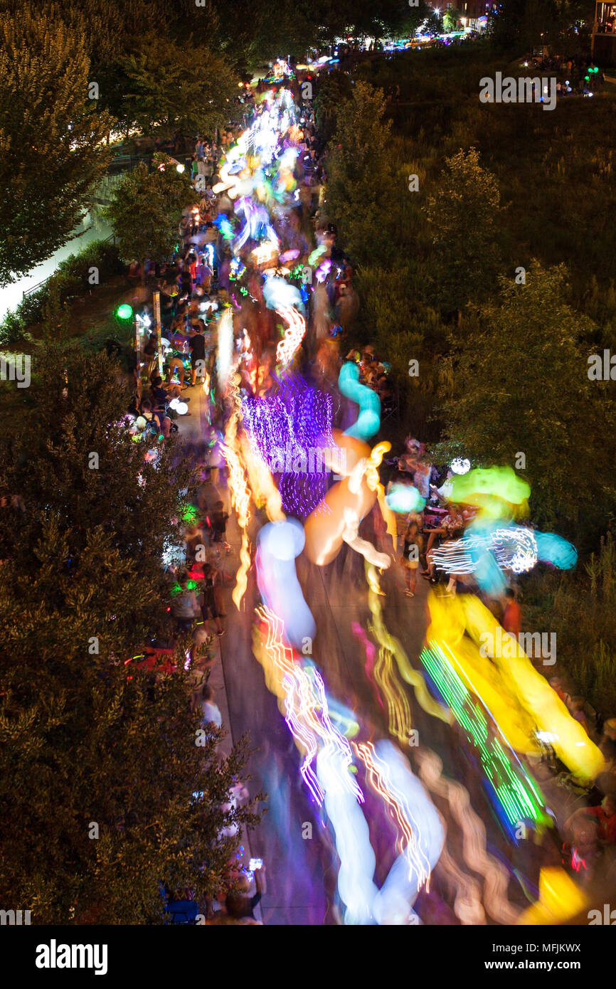 Colorful bright lanterns motion blur and streak as hundreds of people ...