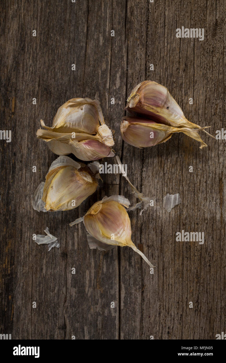 Still life photography taken in studio of garlic on a rustic, wooden ...