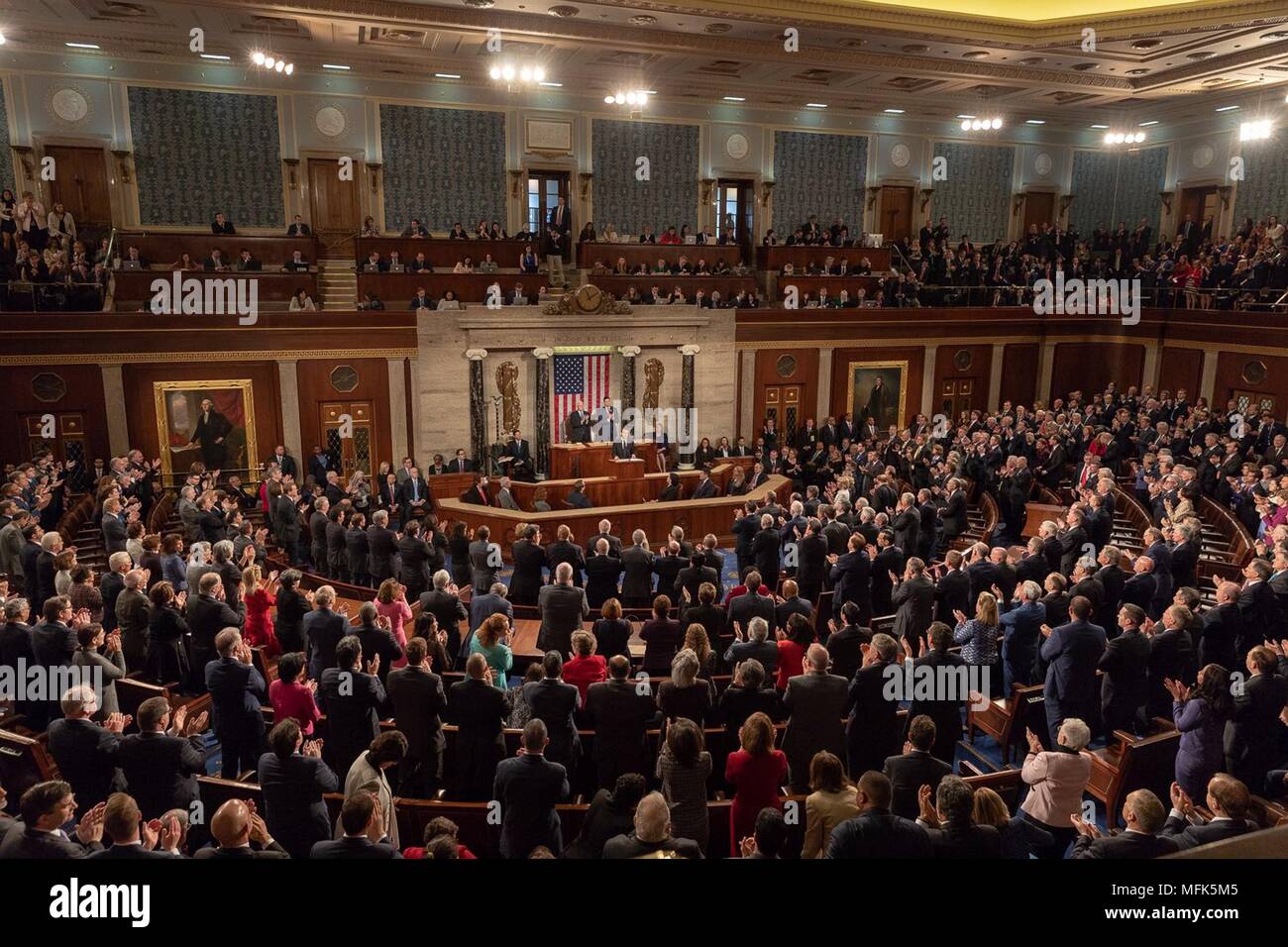 French President Emmanuel Macron receives a standing ovation during his ...
