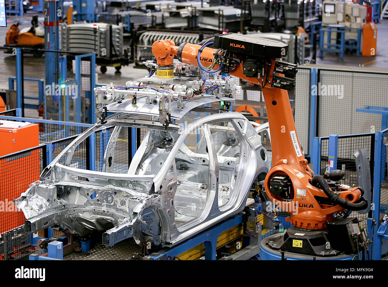 FILED - 24 April 2018, Germany, Cologne: Robots assembling a vehicle ...