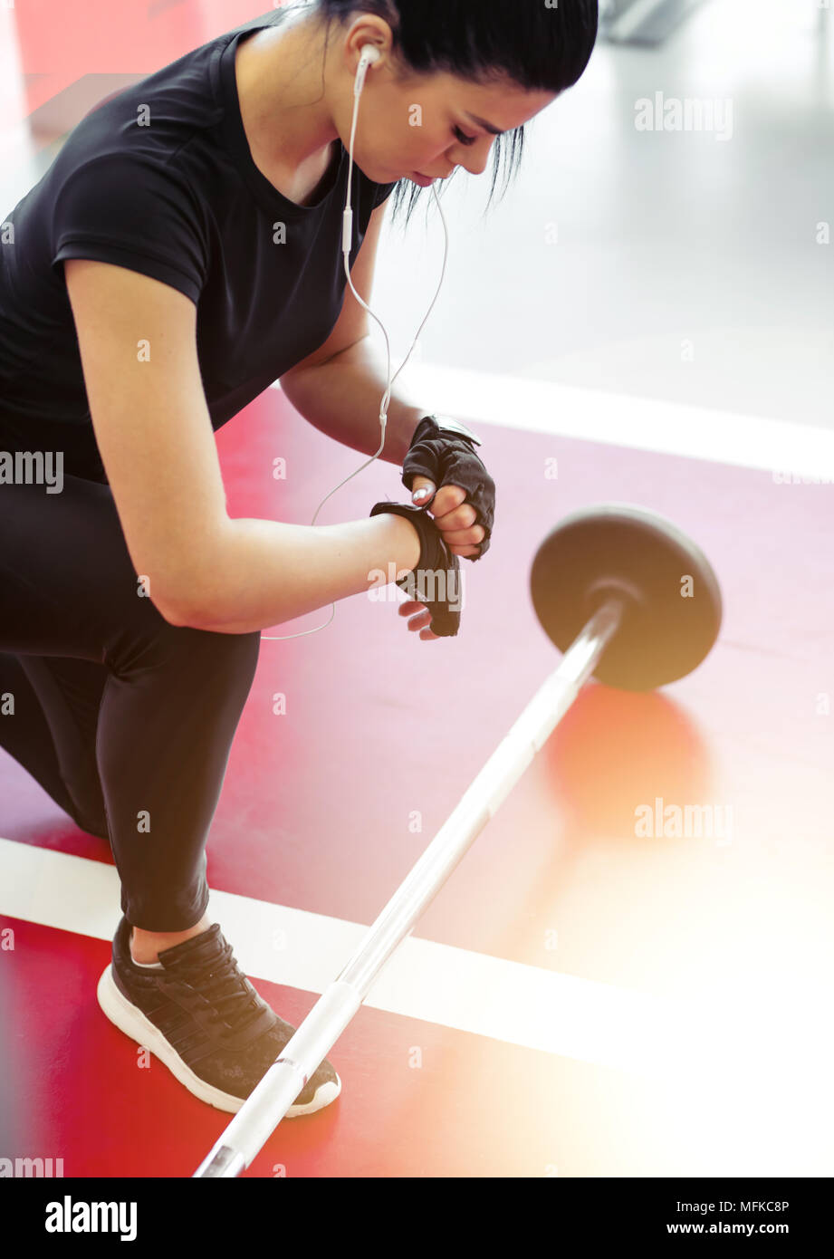 young fitness woman preparing to lift some weights Stock Photo - Alamy