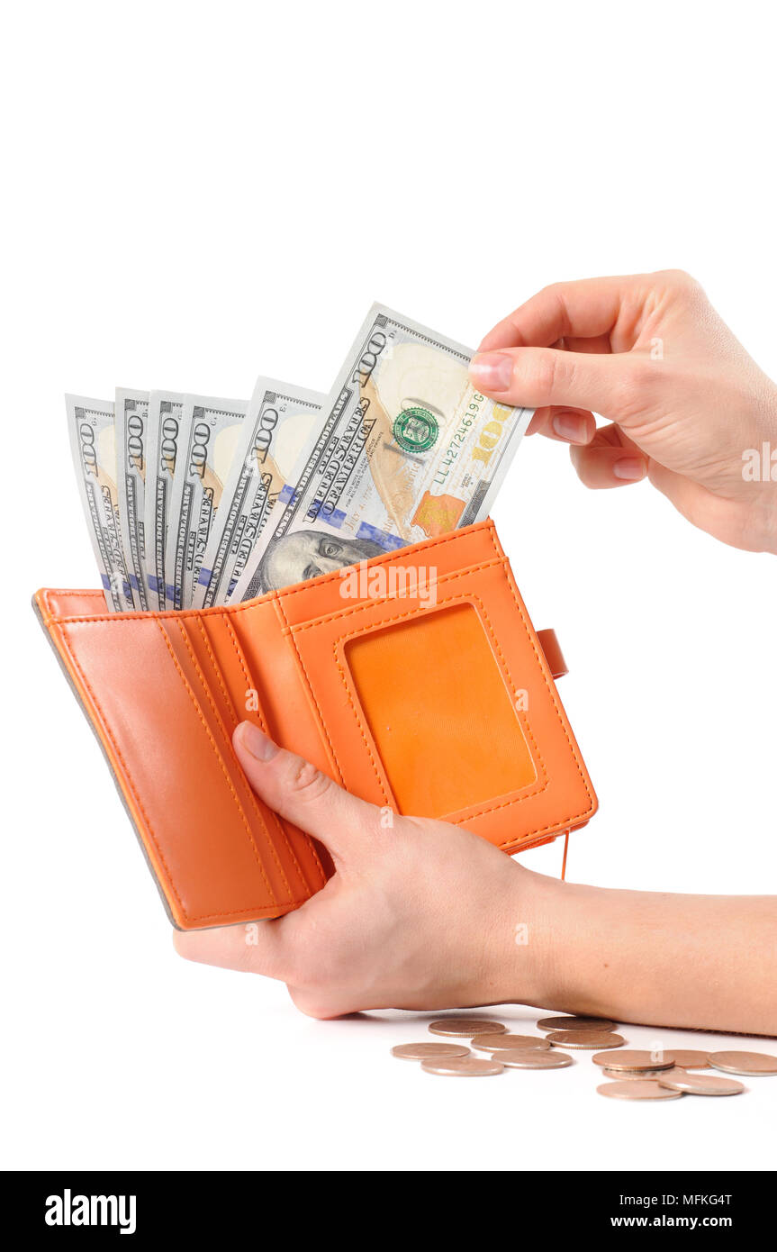 Hands taking out money from wallet. Full wallet of American dollars ...