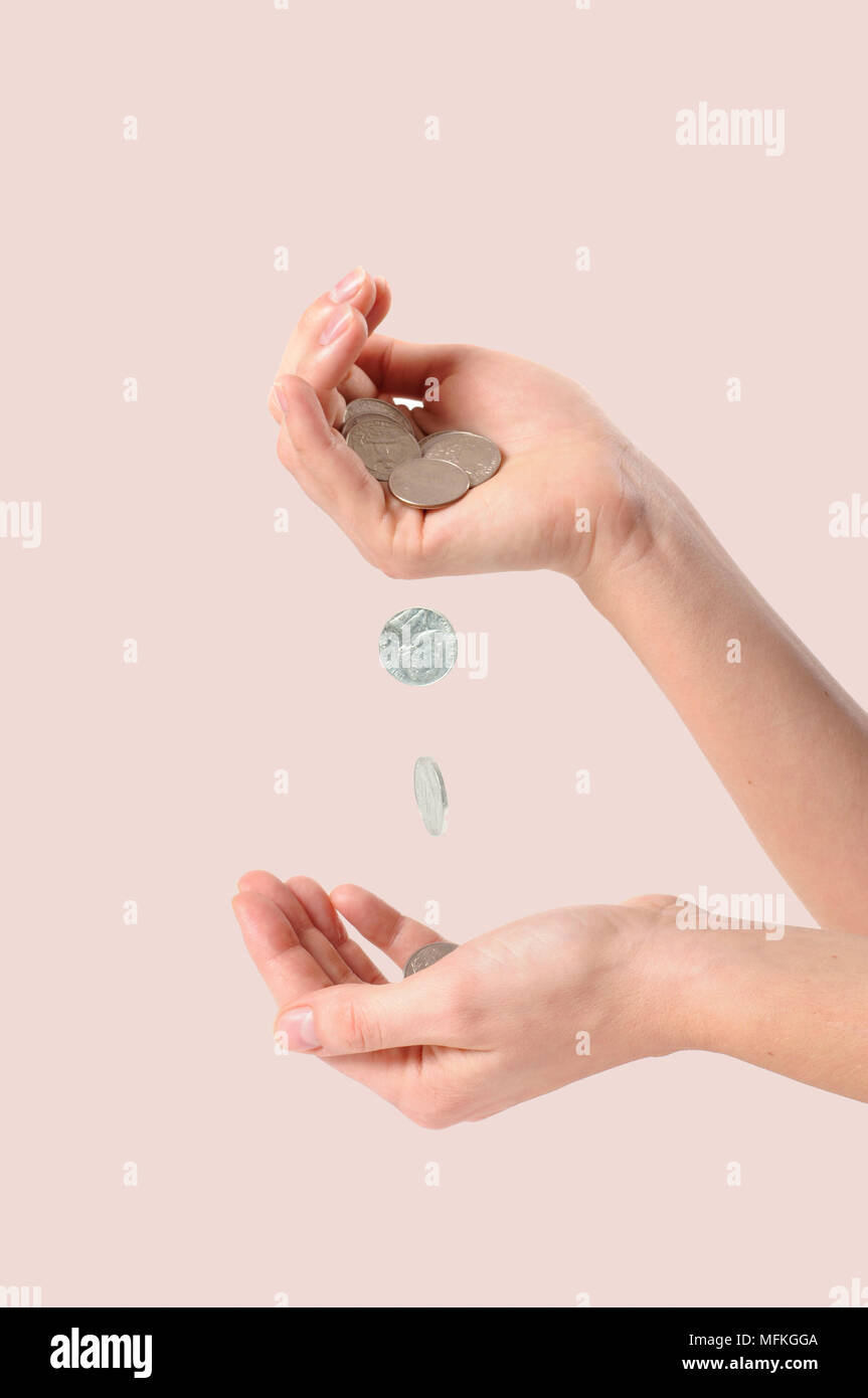 Female hands and falling coins on white background. Coins in palm Stock ...