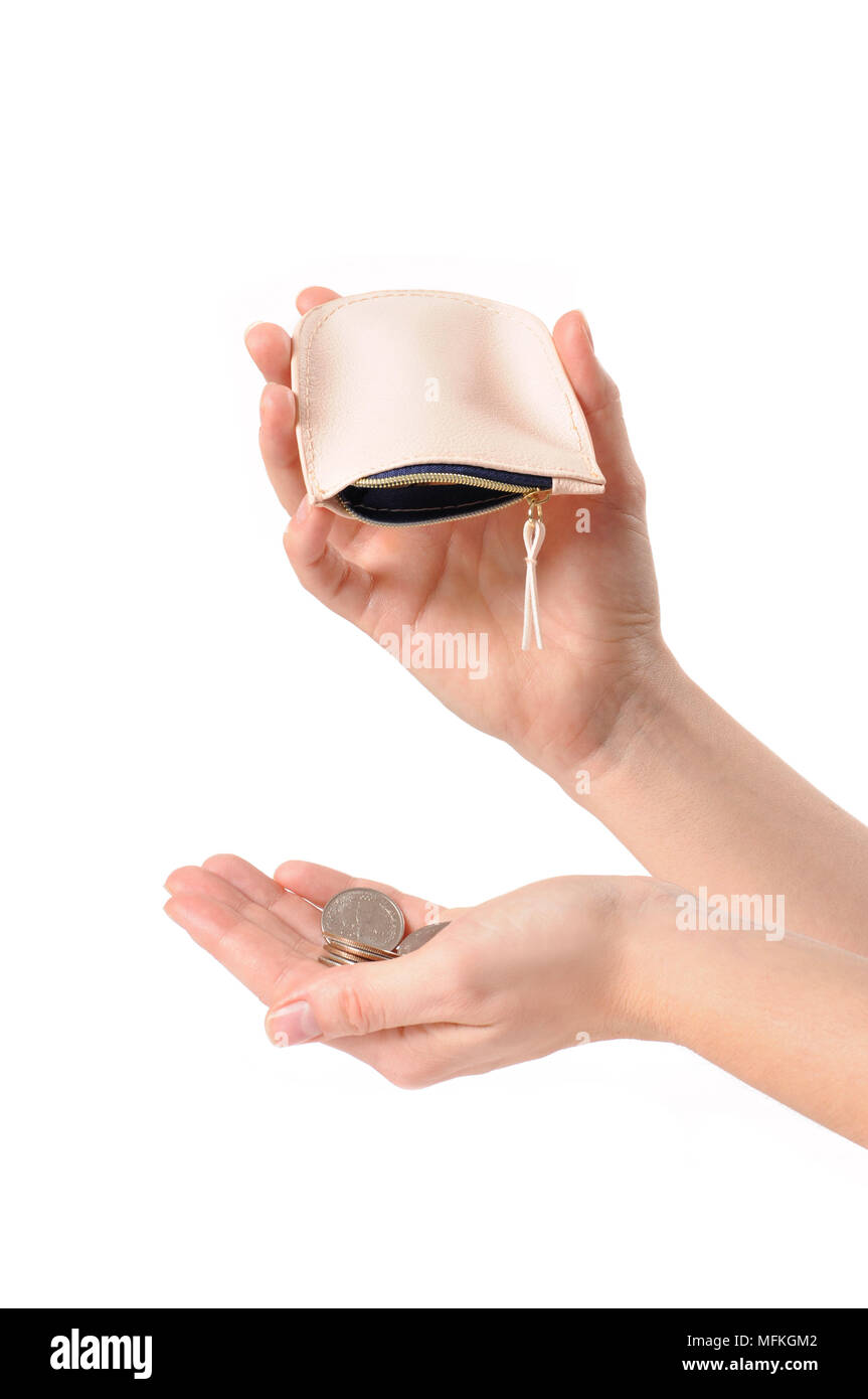 Hand holds the wallet and falling out metal coins. Female hands and ...
