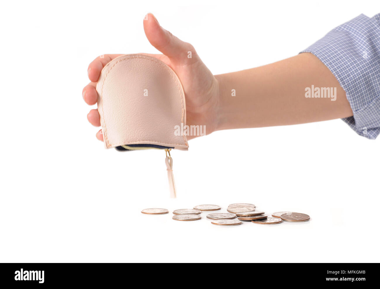 Hand holds the wallet and falling out metal coins. Female hands and ...