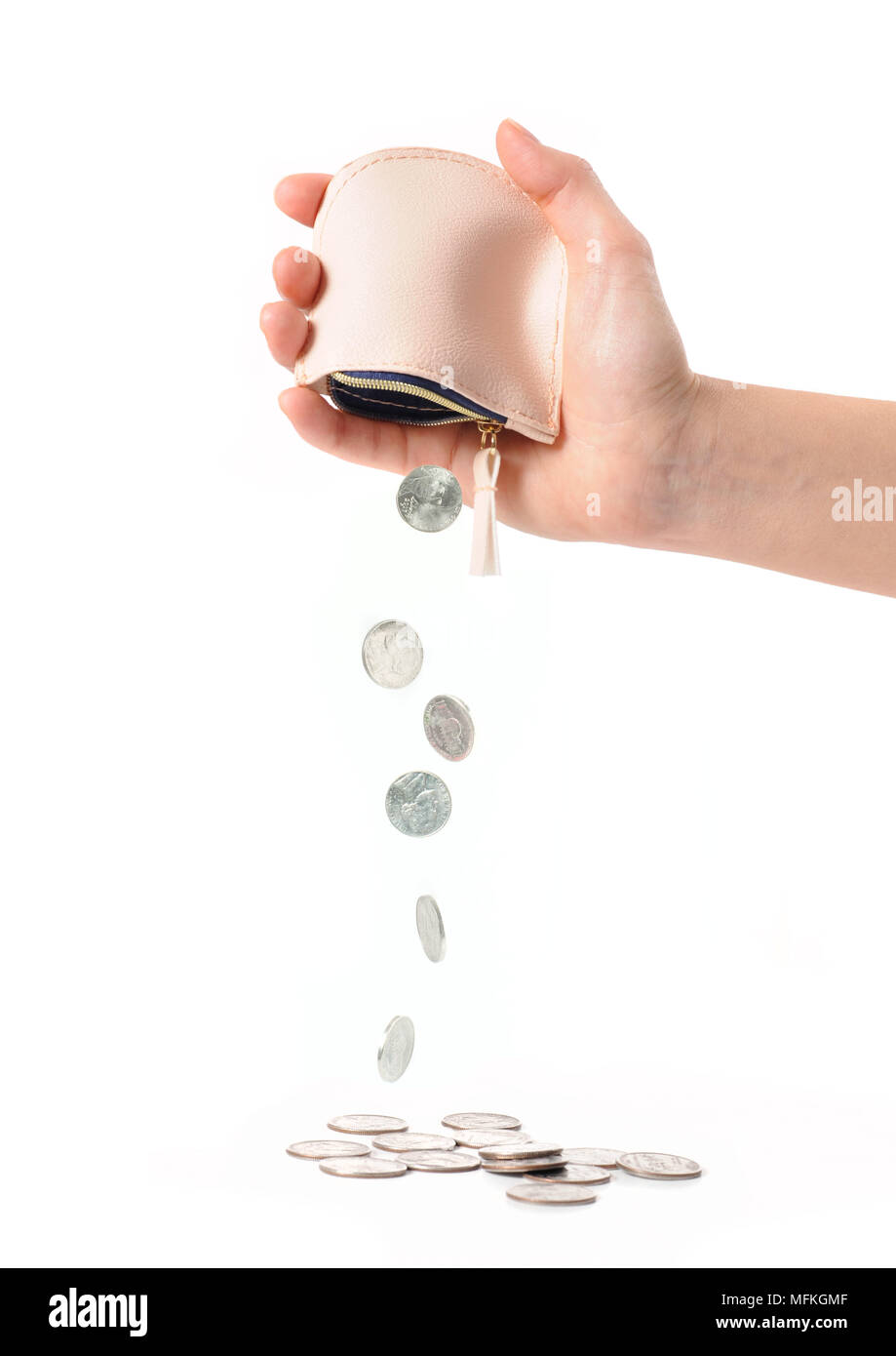 Hand holds the wallet and falling out metal coins. Female hands and ...
