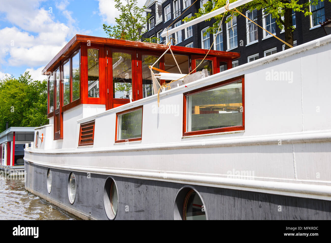 Boat floating in AMsterdam, Netherlands Stock Photo - Alamy