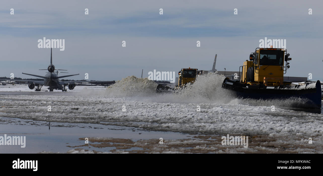 Airmen with the 87th Civil Engineer Squadron snow team use snow plows ...