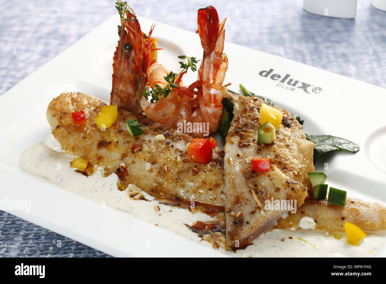 Pangasius fillet with shrimp Stock Photo - Alamy